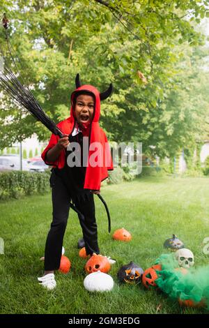 boy in black halloween costume with skeleton bones Stock Photo - Alamy