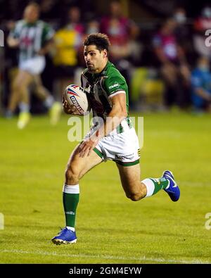 Warrington Wolves' Jake Mamo breaks away to score a try during the ...