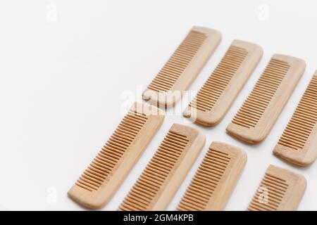 wooden combs scattered isolated on white background, flat lay, top view ...