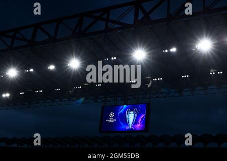 A scoreboard displays the logo and the trophy of UEFA Champions League ...
