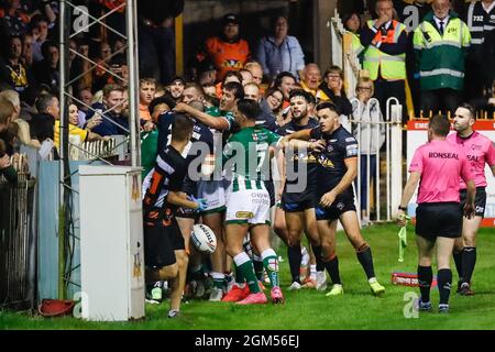 A fight breaks out between the two teams at the end of the first half ...