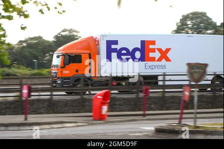 TNT truck on motorway. TNT Express is an international courier delivery ...