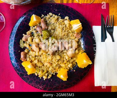 Spanish Migas tropezones from fried flour with bacon, sausage, peppers ...