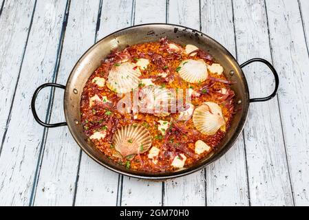 Paella served. Scallops dish. Traditional spanish cuisine bright recipe ...