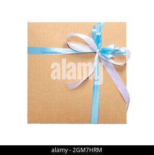 one craft wrapped gift over red background Stock Photo - Alamy