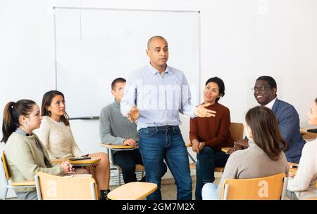 Teacher conducts refresher course for employees Stock Photo - Alamy
