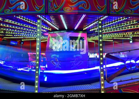 The Waltzer traditional fairground ride at night Stock Photo - Alamy