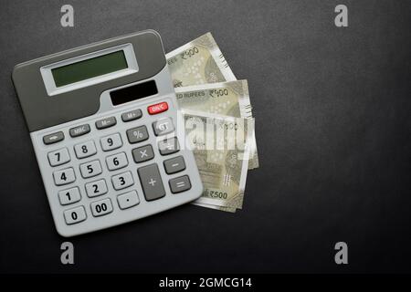 Top view of indian currency note with calculator isolated on white ...