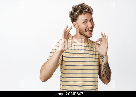 Its A-ok at work. Studio portrait of a handsome young businessman ...