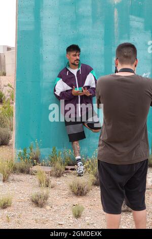 trendy caucasian guy with beard and mustache presenting male perfume on ...