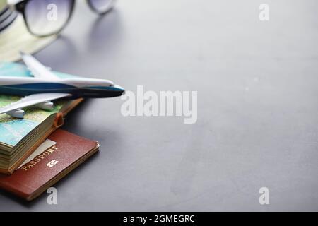 Travel concept. Tourist accessories gather in flight. Alcohol, camera ...