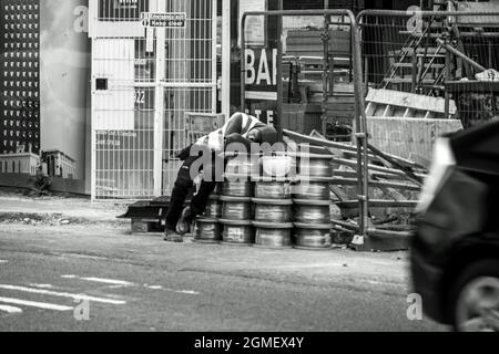 Sleeping on a job. Taking a break. Industrial worker indoors in factory ...