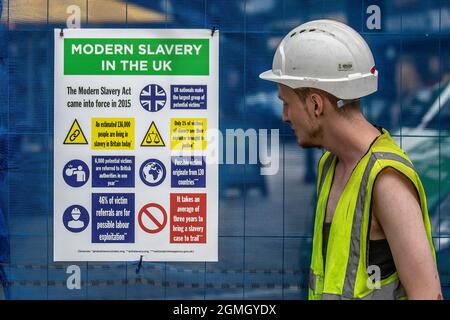 Modern Slavery Act, Forced labour PPE type signs on building site ...