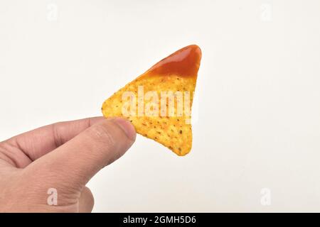 single nacho chip on white background Stock Photo - Alamy