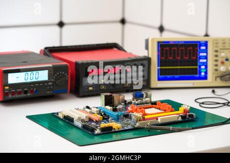 Computer motherboard repair in customer service laboratory workshop ...