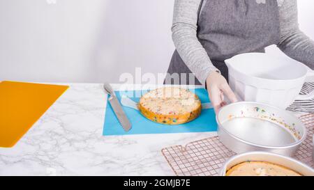Step by step. Wrapping freshly baked funfetti cake into cellophane and ...