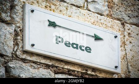 Street Sign the Direction Way to Peace versus War Stock Photo - Alamy