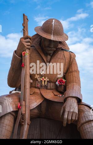 Statue of a British WW1 soldier, wearing a Brody helmet and carrying an ...