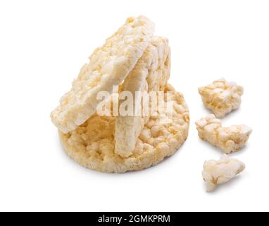 Broken puffed rice crackers on color background Stock Photo - Alamy