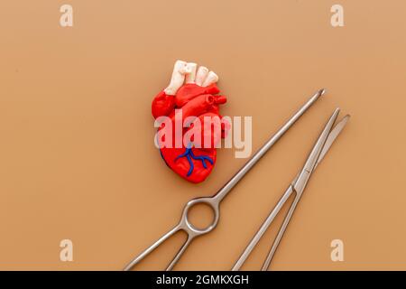 Surgical instruments and heart model. Heart surgery concept Stock Photo ...
