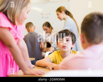 Schoolchildren performing team tasks Stock Photo - Alamy
