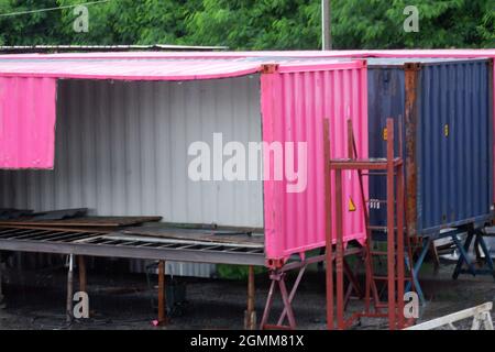 Repairing containers in container depot service Stock Photo - Alamy