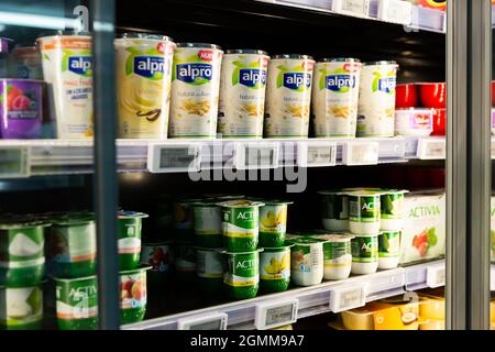 Assortment of various yogurts on store shelves Stock Photo - Alamy