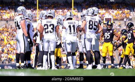 The Pittsburgh Steelers huddle up during an NFL football game against ...