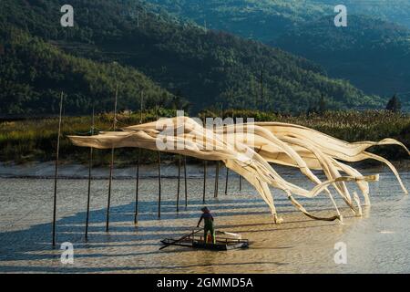 XIAPU, CHINA – DEC 08, 2019: A man at work at a fish sauce factory in ...
