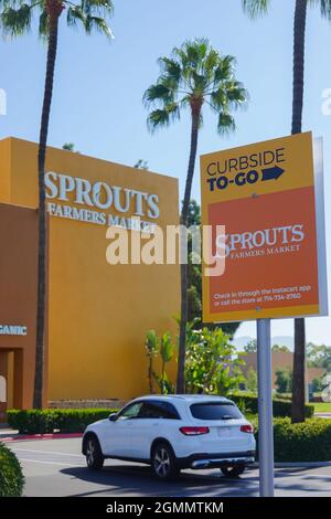 A logo sign outside of Sprouts Farmers Market retail grocery store in ...