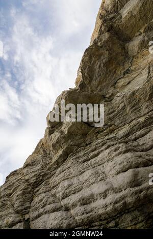 rocky mountains with steep stony slopes with meadows. summer day with ...