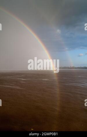 Rainbow over river Amazon in Brazil Stock Photo - Alamy