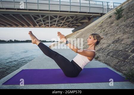 Woman exercising pilates. Teaser exercise Stock Photo - Alamy