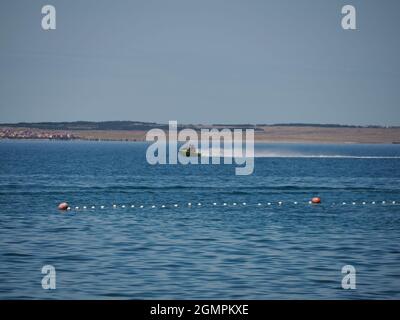 Scenic view of sea floaters n the surface of the water at summertime ...