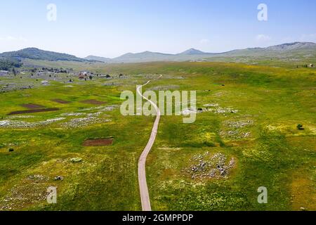 aerial view of a beautiful Lukavica plateau and grass meadow full of ...