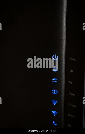 Modem with blue light Stock Photo - Alamy