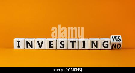 Investing yes or no symbol. Turned a wooden cube and changed words ...