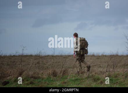 British army soldier completing an 8 mile combat fitness test tabbing ...