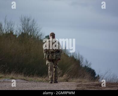 British army soldier completing an 8 mile combat fitness test tabbing ...