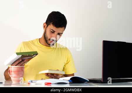 The young student preparing for exams at home Stock Photo - Alamy