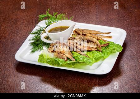 Fried barabulka fish snack with sauce Stock Photo - Alamy