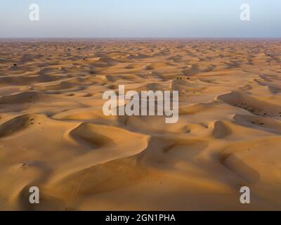 Aerial view of Arabian Nights Village desert resort amid dunes at ...
