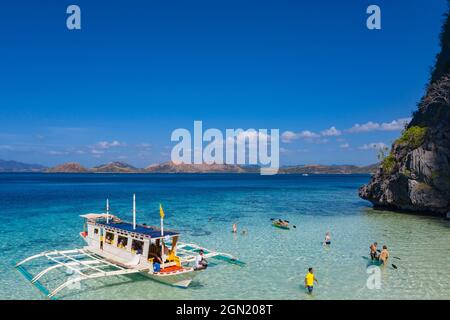 Aerial view of traditional Filipino Banca outrigger canoes and port ...