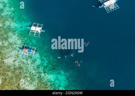 Aerial view of guests enjoying a snorkeling trip at the Skeleton Wreck ...