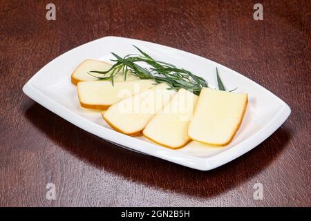 Caucasian tradition cheese plate served green herbs Stock Photo - Alamy