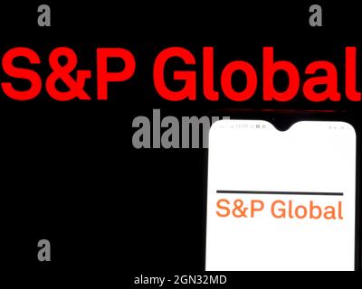 In this photo illustration, a S&P Global logo is seen displayed on a ...
