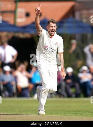 Lancashire's Tom Bailey celebrates taking the wicket of Yorkshire's ...