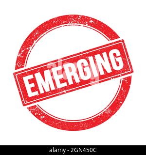 EMERGING text on red grungy vintage rubber stamp Stock Photo - Alamy