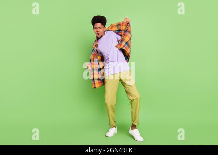 Photo of pretty funky dark skin guy dressed checkered shirt showing v ...