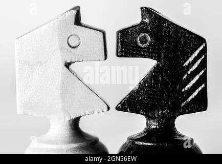Two knights face each other in a game of chess Stock Photo - Alamy